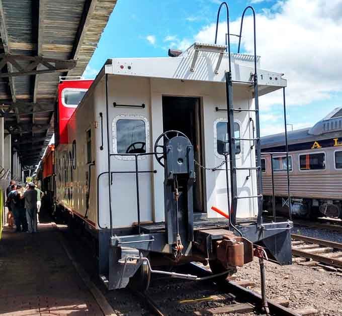 That classic caboose brings up the rear like the punctuation mark at the end of a perfectly composed sentence.