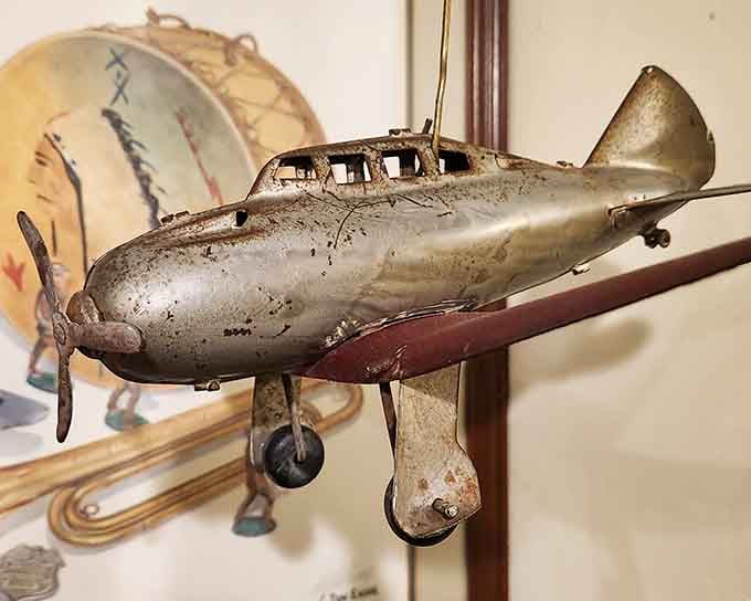 This weathered metal plane has seen decades of imaginary dogfights and daring rescue missions in countless young hands.