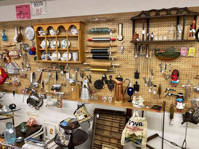 Pegboard perfection displays everything from vintage kitchen gadgets to collectibles that spark instant childhood flashbacks and smiles.
