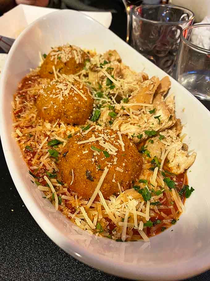 Golden-brown meatballs nestled in pasta prove that some culinary classics simply cannot and should not ever be improved upon.