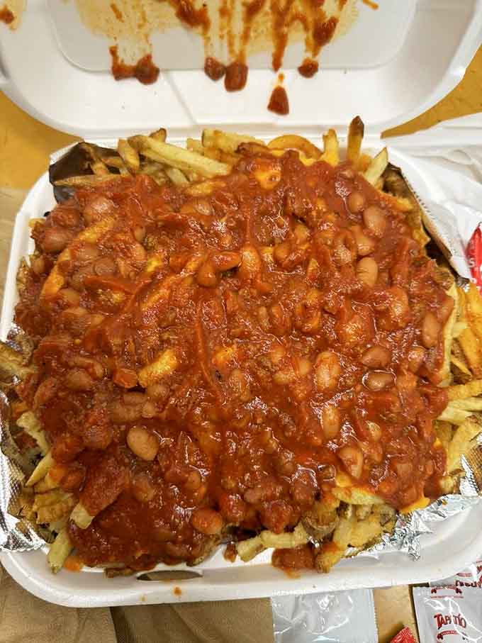 This mountain of chili cheese fries could feed a small army or one very determined individual with priorities.