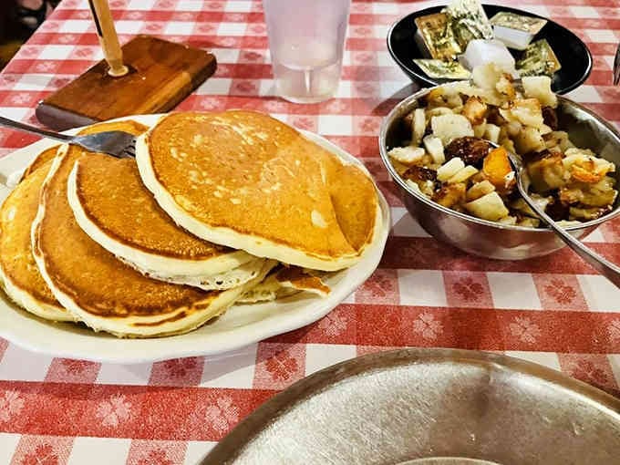 Fluffy pancakes and golden fried potatoes arrive in quantities that would make any lumberjack proud.