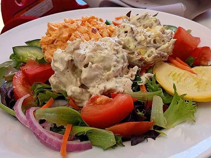 Fresh greens piled high with chicken salad and carrot slaw prove that healthy eating doesn't mean sacrificing flavor.