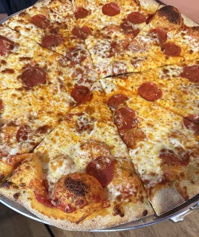 A whole pepperoni and beef pizza that makes standard pizzas look like appetizers for ants.