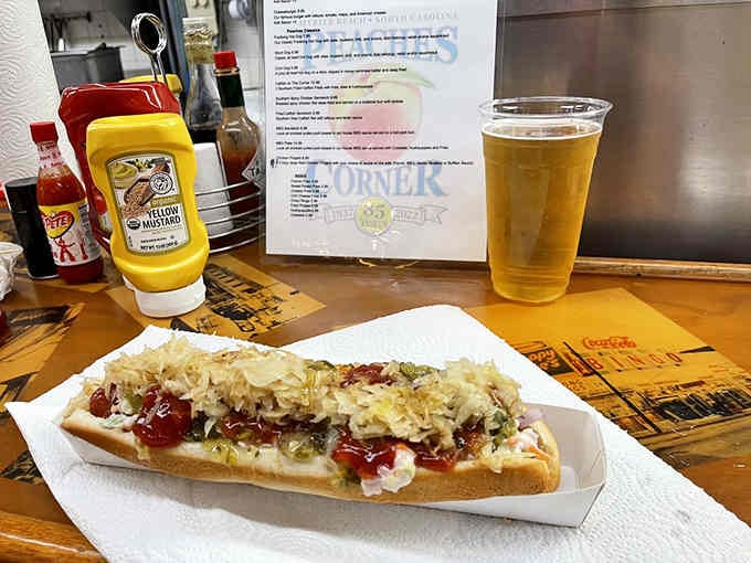 That footlong hot dog topped with slaw and chili is basically a delicious engineering challenge on a bun.