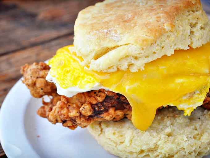 Golden, flaky perfection cradling fried chicken and egg, because sometimes breakfast needs to be taken very seriously.