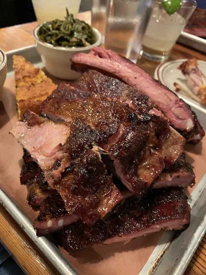 A mountain of perfectly smoked ribs that would make any pitmaster weep tears of joy and pride.