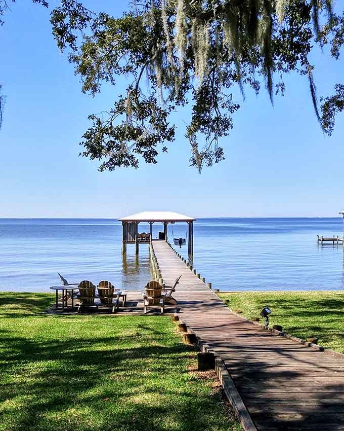 Spanish moss, calm water, and Adirondack chairs create the ultimate "out of office" reply setting.