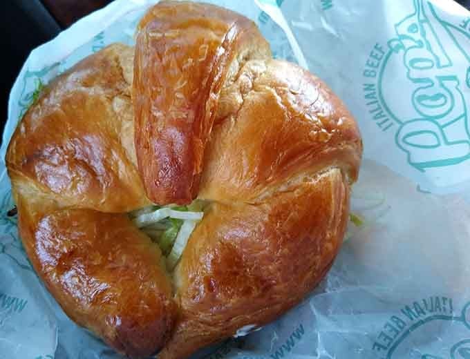 That golden croissant holds secrets within, proving Pop's knows how to think outside the traditional Italian roll.