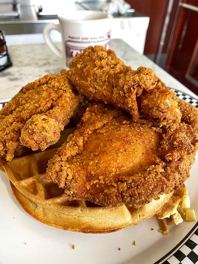 Chicken and waffles topped with enough crispy goodness to make Colonel Sanders weep tears of joy and envy.