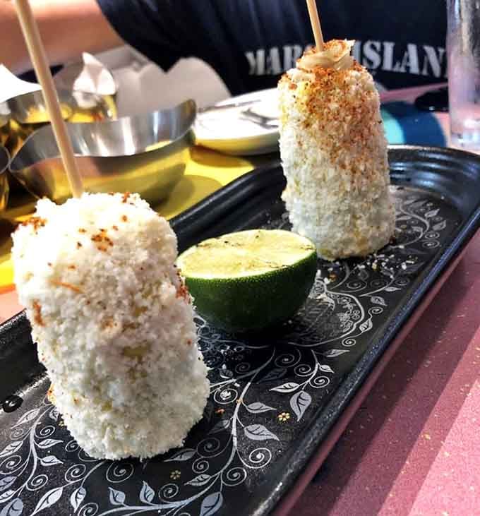 Elote loco lives up to its name, covered in toppings that transform humble corn into pure magic.