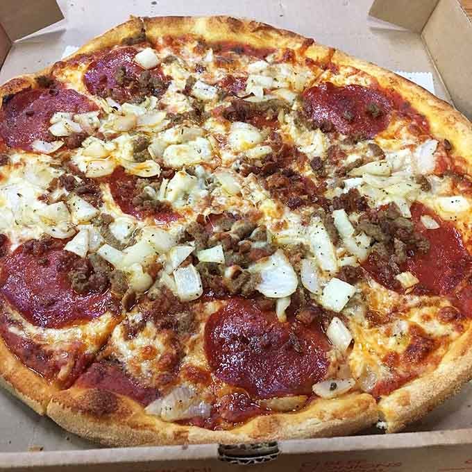 Pizza done right, with garlic and cheese creating harmony that would make any Italian grandmother nod with approval.