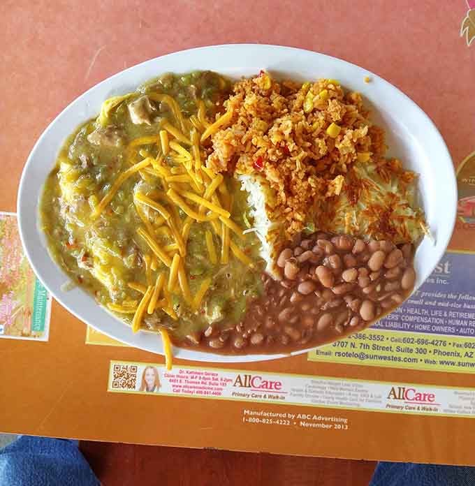 Huevos rancheros arrive with beans, rice, and enough cheese to make your cardiologist schedule a follow-up appointment, worth every bite.