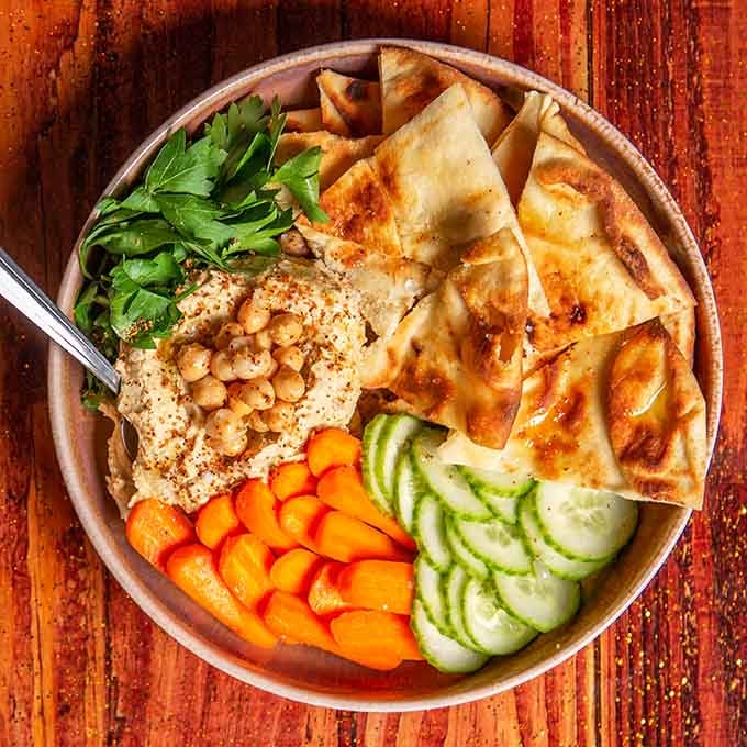 Hummus so photogenic it probably has its own Instagram account with more followers than you do.