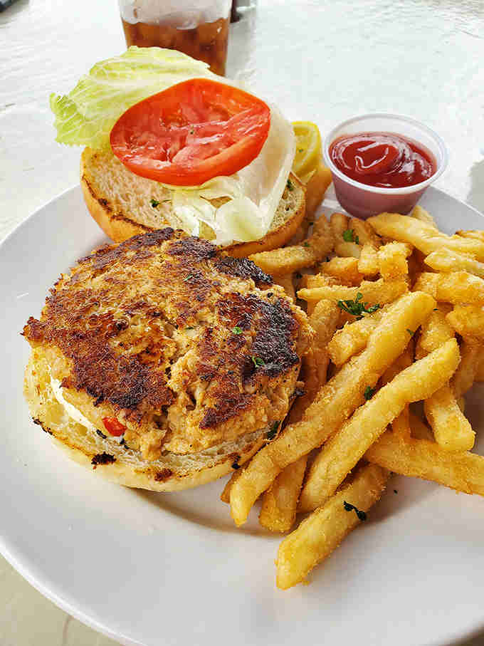 That grouper cake sandwich is giving "I'm too fancy for a regular burger" energy, and we're absolutely here for it.