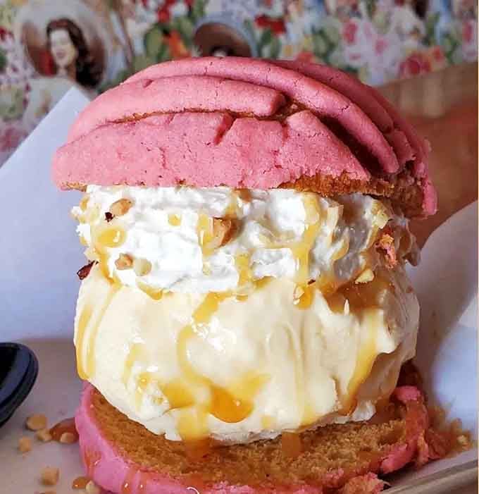 Pink concha cookies sandwiching ice cream and caramel is the kind of genius that changes lives forever.