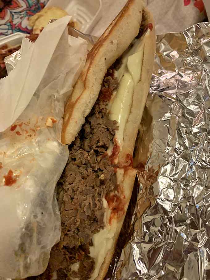 A cheesesteak so generously stuffed, it practically requires an engineering degree to eat without making a mess.
