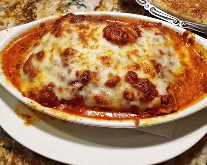 Veal parmigiana swimming in marinara with cheese that's achieved peak golden-brown perfection&mdash;absolute beauty.