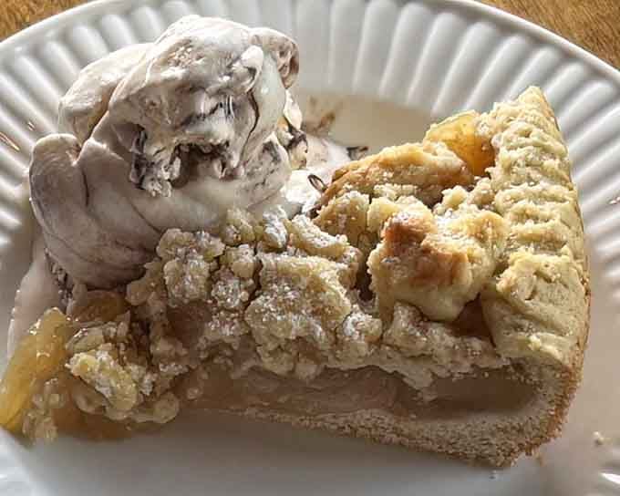 Apple strudel with streusel topping and ice cream, because apparently one dessert element just isn't enough for proper indulgence.
