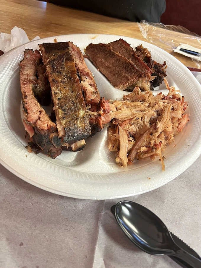 Sliced brisket so tender it surrenders without a fight, accompanied by pulled pork that's been smoked to absolute perfection.