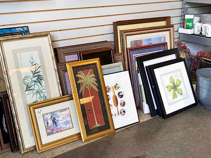 Framed artwork leans against the wall, waiting to transform someone's blank space into a gallery-worthy display for pocket change.