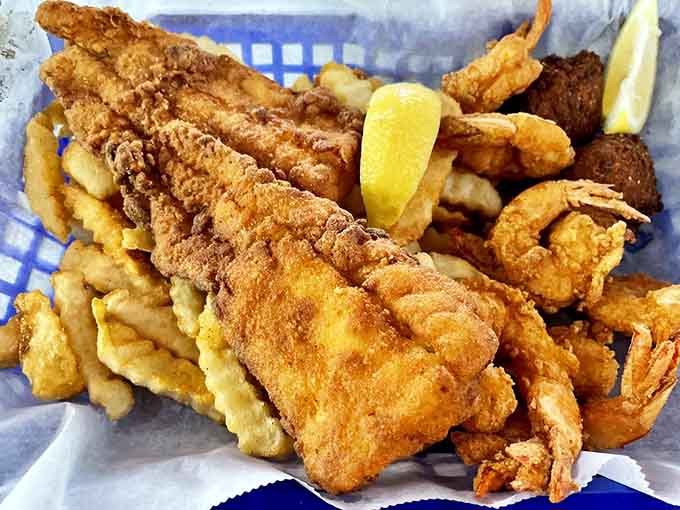 This seafood basket looks like someone raided the ocean's treasure chest and fried everything to absolute crispy perfection.