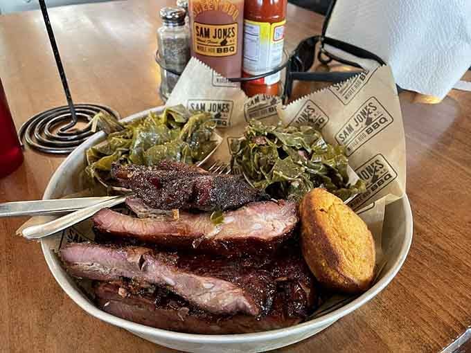 These glistening spare ribs with collard greens look like they've been slow-smoked into tender, fall-off-the-bone submission.