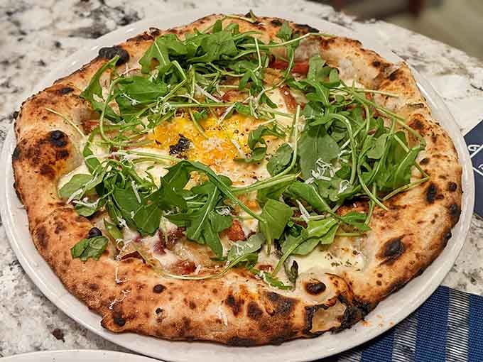 Fresh arugula piled high on bubbling cheese creates a flavor combination that'll make you swoon happily.