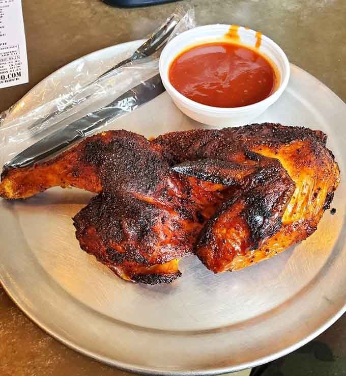 Half a smoked chicken with bark so beautiful it deserves its own gallery showing before you devour it.