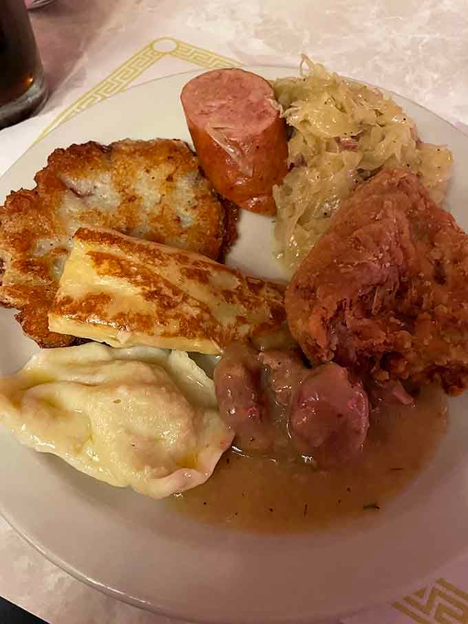 Potato pancakes, kielbasa, and pierogi together on one plate is the Polish trifecta of pure happiness.