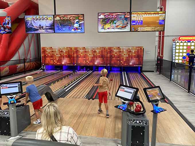 Bowling lanes glow with digital pizzazz, transforming America's favorite pastime into a neon-lit spectacle of strikes and spares.