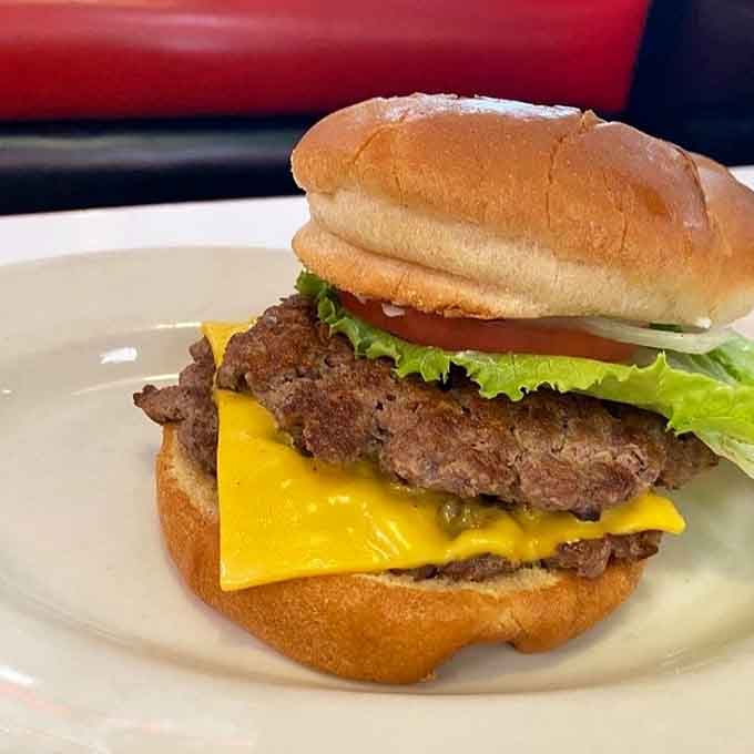 Melted cheese cascading over a perfectly cooked patty on a soft bun&mdash;this is burger architecture at its most beautiful and affordable.