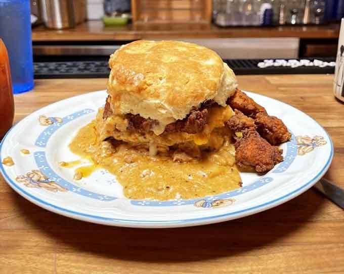 Fried chicken perched on a biscuit with all the fixings, proving that some sandwiches are worth loosening your belt for.
