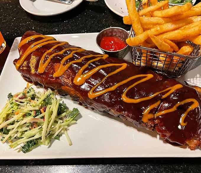 BBQ ribs glazed to perfection with a side of slaw, because sometimes messy eating is the best eating.