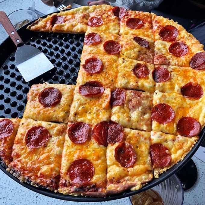 Classic pepperoni pizza with those crispy-edged slices of heaven that make you remember why you fell in love with pizza.