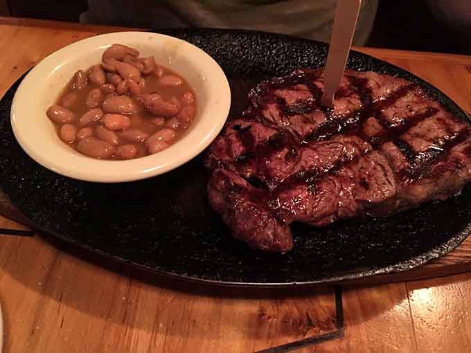 Look at that ribeye with its beautiful char marks, served alongside beans that know their supporting role perfectly well.