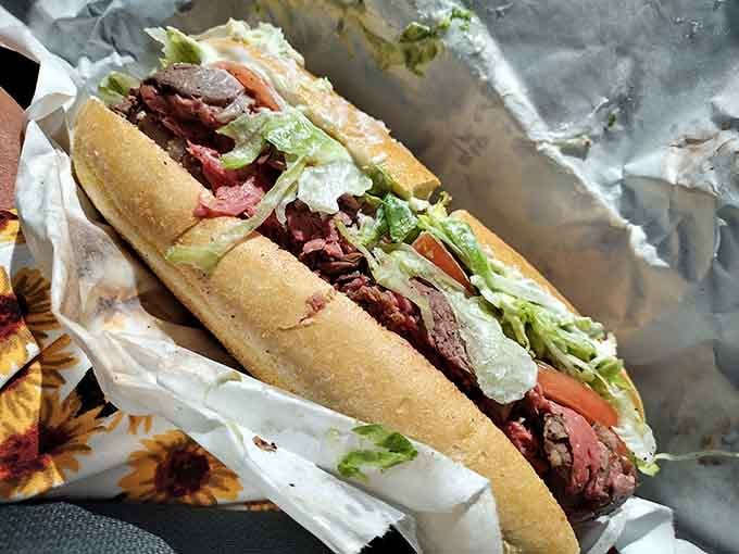 Roast beef piled high with fresh vegetables on a proper sub roll proves size absolutely matters here.