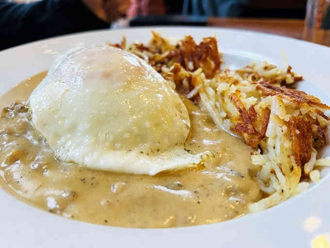 Biscuits and gravy with hash browns: the breakfast that understands exactly what your soul needs this morning.