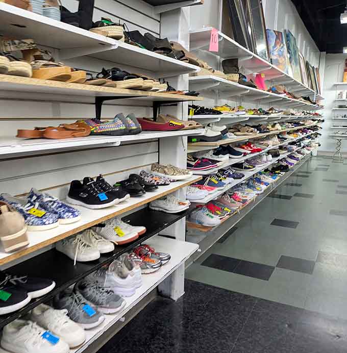 Sneakers, heels, and boots lined up like soldiers ready for adoption, each pair waiting for their second chance at glory.