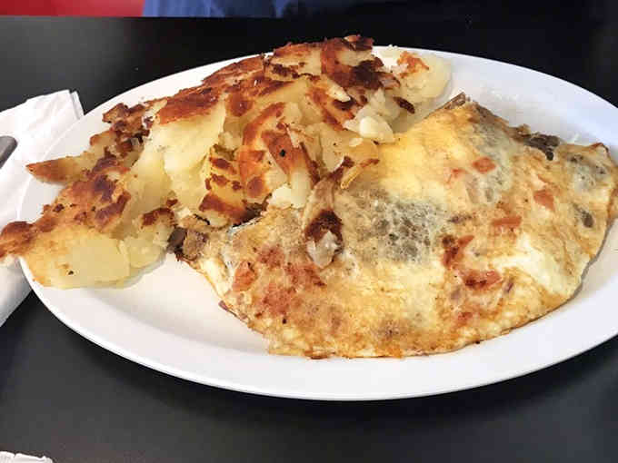 When an omelette achieves this level of fluffy perfection, you understand why people become regulars at their favorite diners.