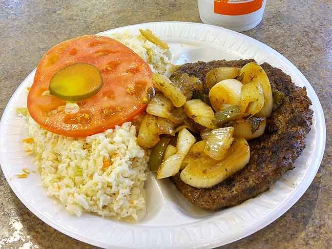 That hamburger steak with caramelized onions and sides looks like comfort food that actually lives up to the name.