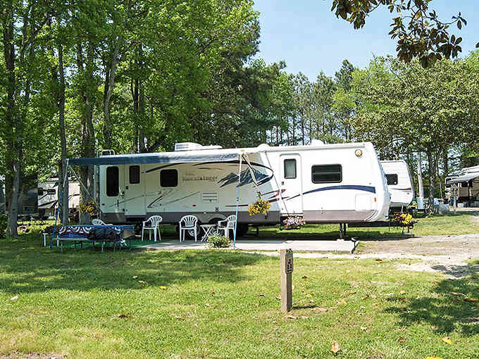Your RV setup complete with lawn chairs and shade trees, because camping doesn't mean sacrificing your outdoor living room.