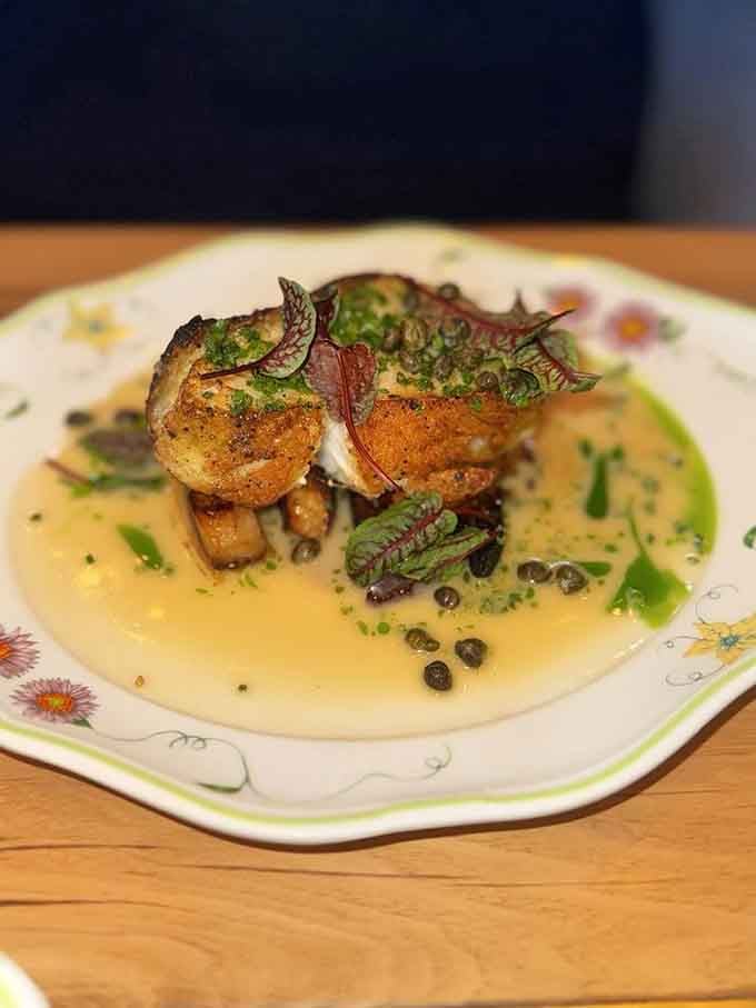 That branzino is swimming in flavor, proving that fish can absolutely be the star of the show.