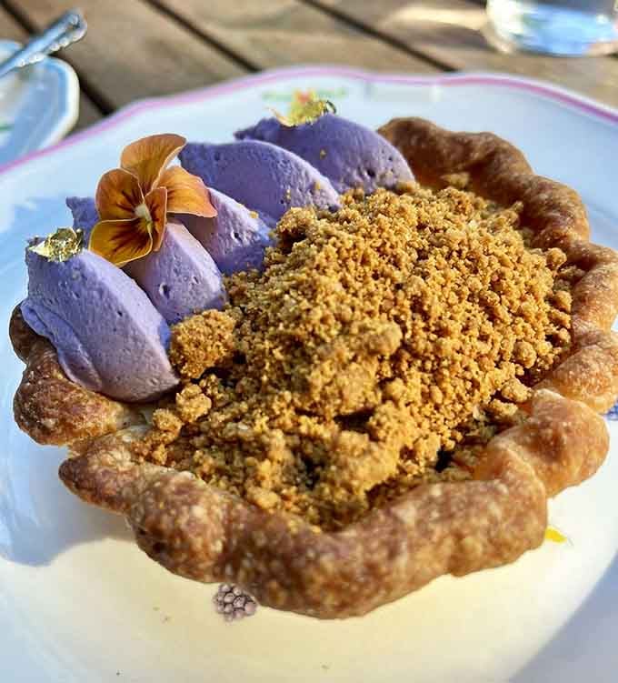 Purple mousse meets golden crumble in this artistic tart that's almost too pretty to eat, but you absolutely will.