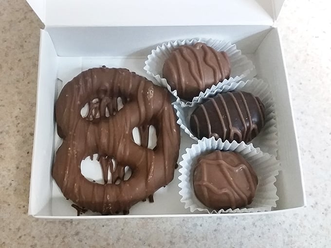 A chocolate-covered pretzel and butter creams nestled in paper cups, ready to make someone's day infinitely better.