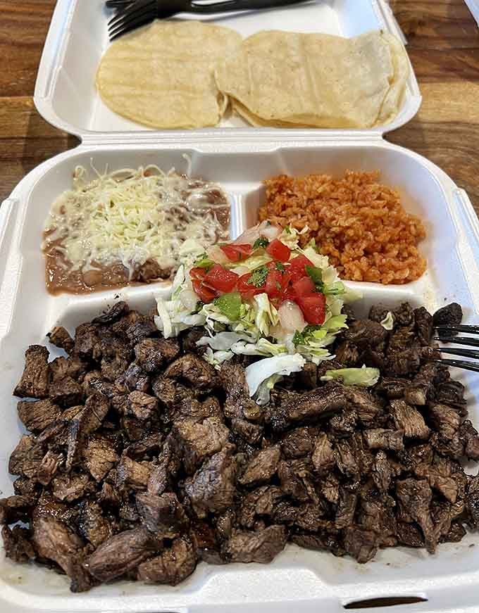 The carne asada plate arrives with enough protein to fuel a marathon, plus rice, beans, and fresh tortillas.