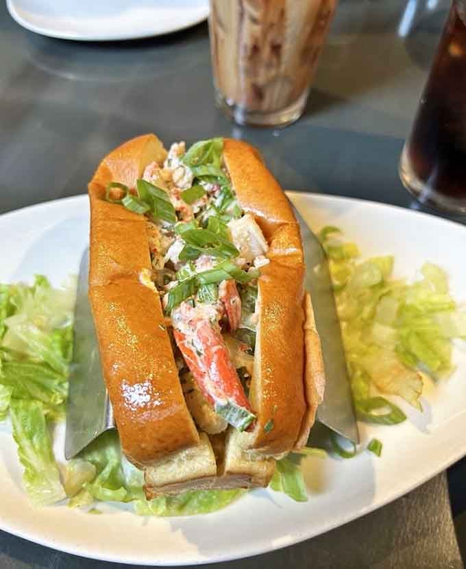 A lobster roll so generously stuffed, it makes you wonder if they know something about portion control they're not sharing.