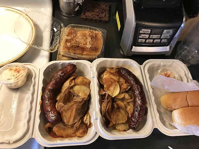 Sausage and pulled meat sharing space like old friends who've been through the smoker together.