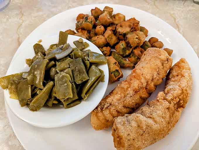 Perfectly breaded fried cod with green beans proves that cafeteria-style doesn't mean compromising on quality or flavor.