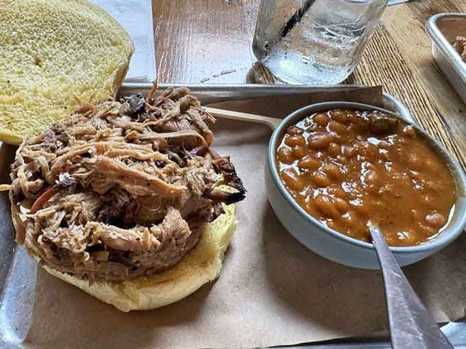 Pulled pork piled high on a bun, proving that sometimes the simplest presentations are the most devastatingly delicious.